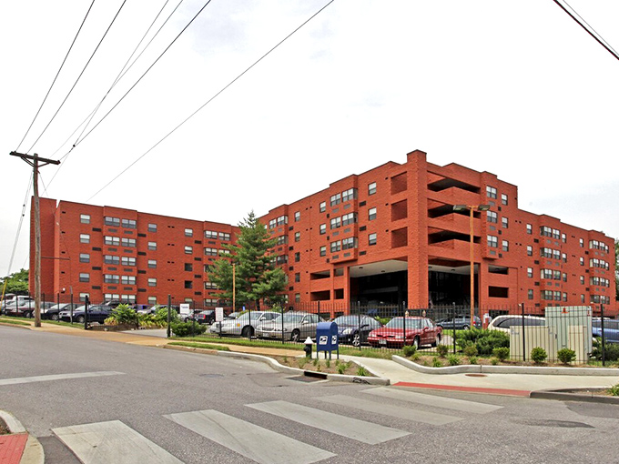 Alpha Terrace's bold red brick stands as a testament to classic St. Louis architecture in an urban setting.