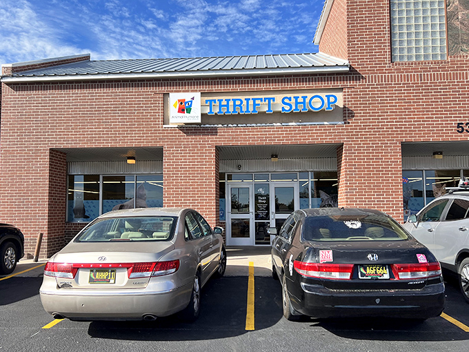 The Animal Humane Thrift Shop's brick facade houses countless treasures. Every purchase here helps furry friends find forever homes!