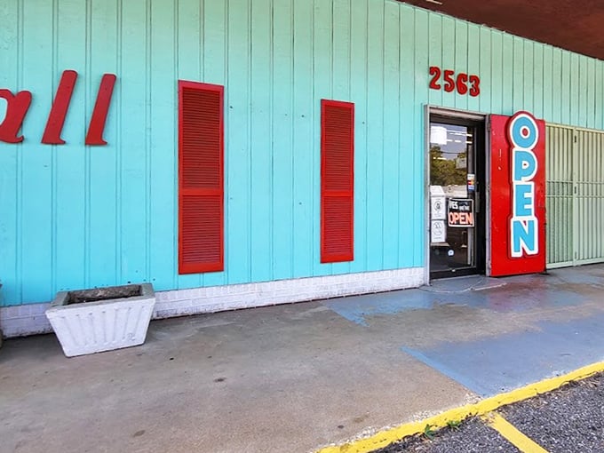 That turquoise exterior is impossible to miss - like a vintage Cadillac parked among modern sedans, absolutely stunning.