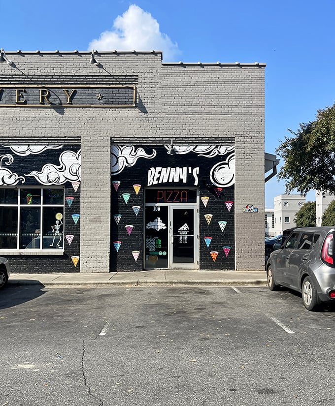 Street art meets street eats! Benny Pennello's colorful pizza slice mural is like a beacon for hungry night owls.