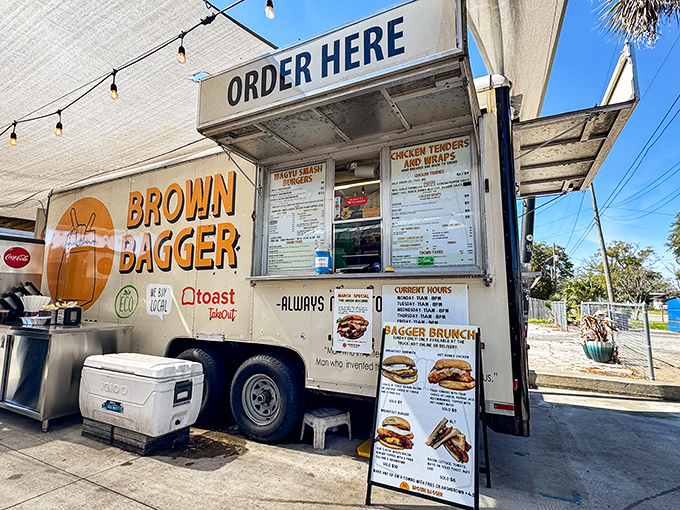 The Brown Bagger food truck brings big burger flavor in a mobile package. That "ORDER HERE" sign points the way to happiness!