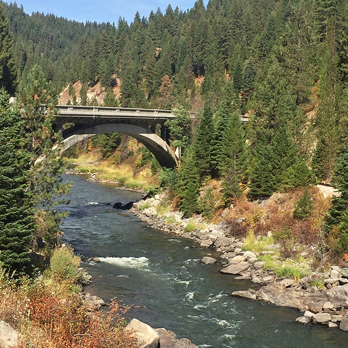 A classic Idaho river bridge that makes you wonder if Norman Rockwell and Mother Nature collaborated on the perfect landscape.