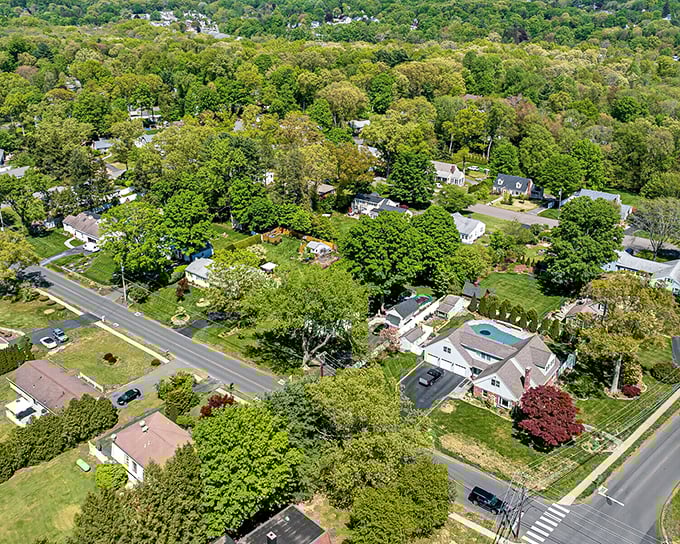 Aerial views reveal spacious lots and mature landscaping where retirement living means room to breathe affordably.