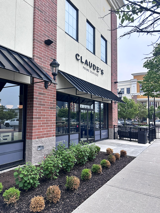 Claude's sleek exterior gives a hint of the sophisticated seafood experience waiting inside. Modern elegance meets ocean freshness!