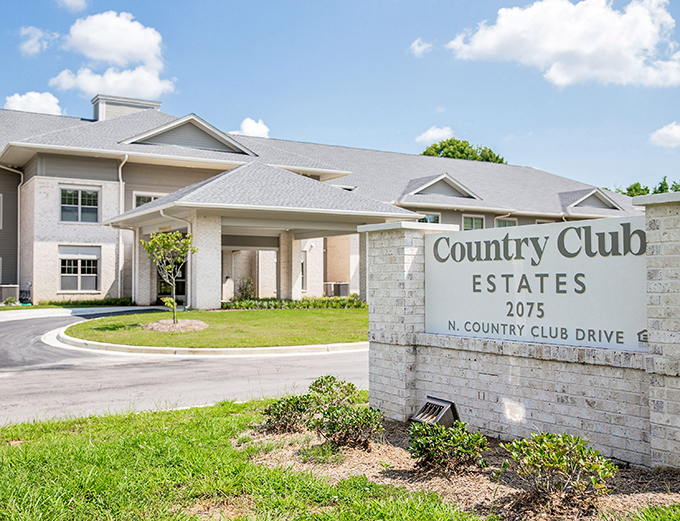 Country Club Estates welcomes you with stone elegance and the promise of gracious living.