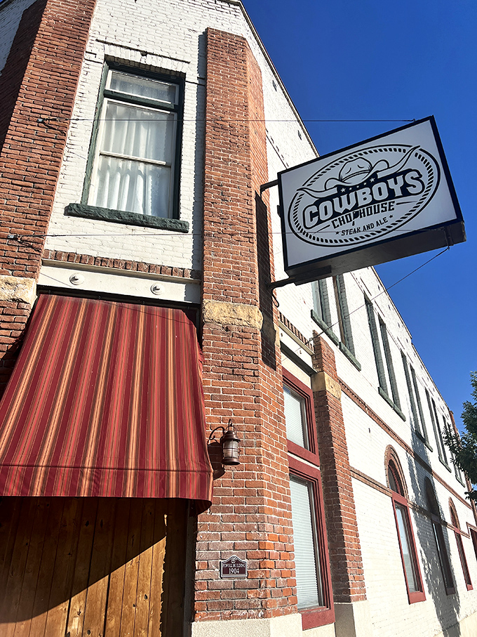 Cowboys Chophouse's vintage brick building and striped awning whisper of Emmett's history and hearty meals.