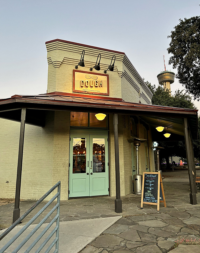 Dough's elegant white brick building houses pizza royalty. San Antonio's wood-fired wonder sits ready for your discovery.