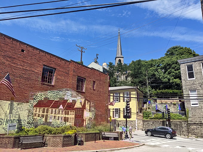 Church spires pierce the sky while colorful murals celebrate this riverside community's artistic spirit.
