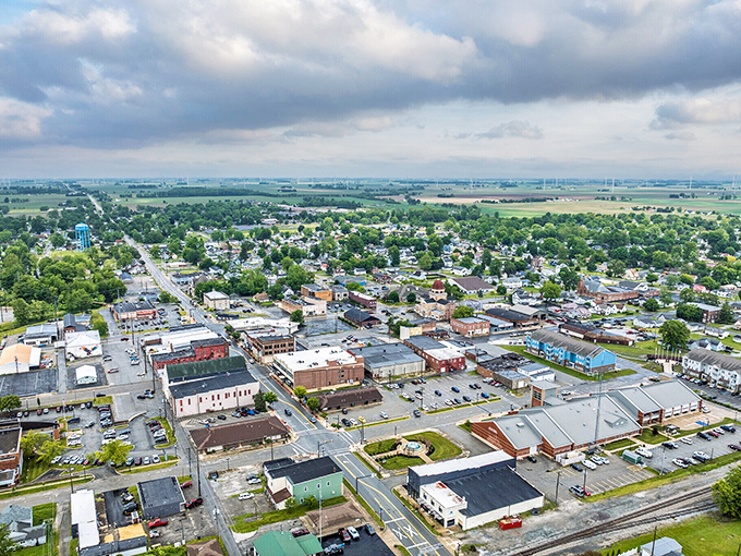 Bird's-eye bargain! Elwood's geometric grid of possibility spreads like a real-life Monopoly board, where affordable properties meet farmland vistas worthy of a Midwest tourism brochure.