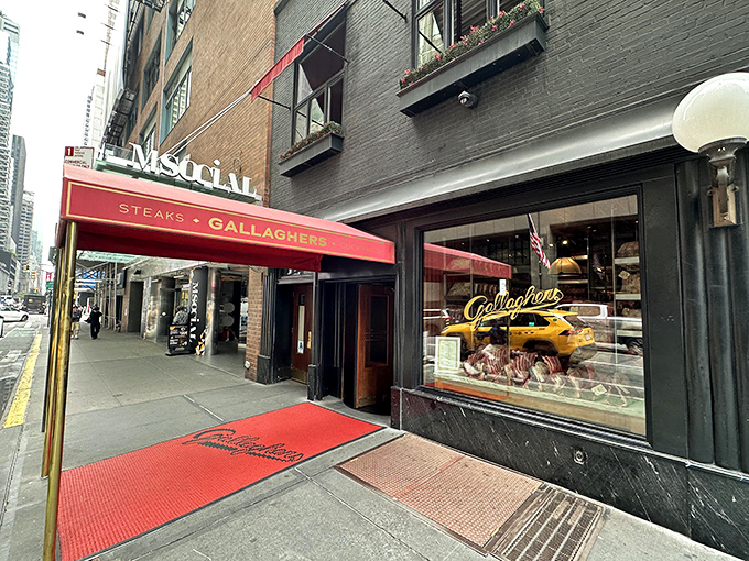 Gallagher's crimson awning stretches toward Times Square &ndash; a meaty beacon amid Broadway's neon wilderness.