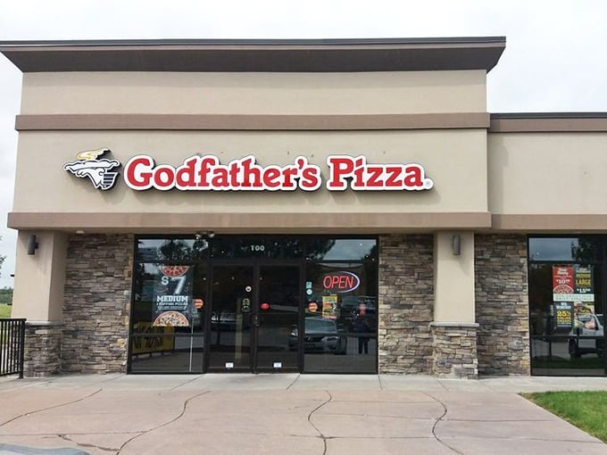 That stone facade hints at the solid pizza traditions waiting inside this neighborhood favorite spot.