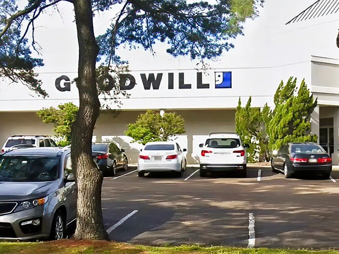 Goodwill's familiar logo signals serious thrift shopping ahead - where every pound purchased supports community programs and dreams.