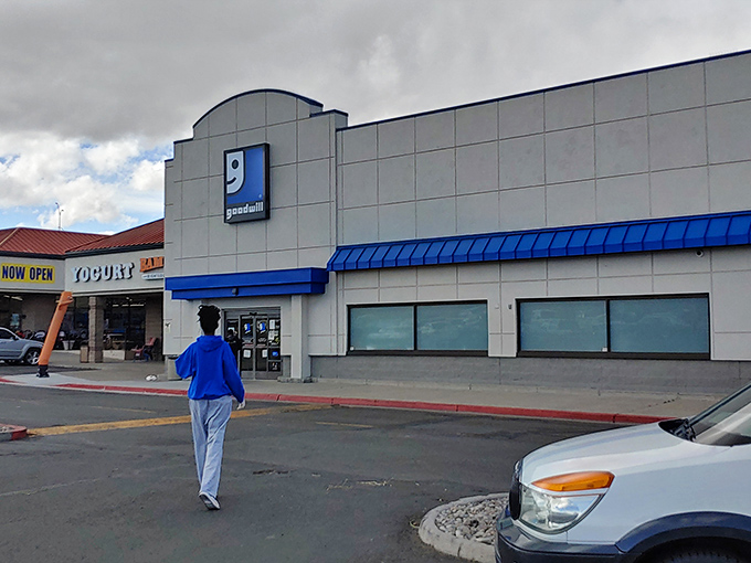 Goodwill's iconic blue logo stands out like a beacon for bargain hunters navigating the sea of retail sameness.