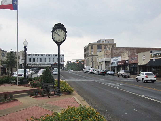 Henderson's town square clock doesn't just tell time—it reminds you to take your time. The Texas flag waves proudly over a downtown where nobody's in a hurry.