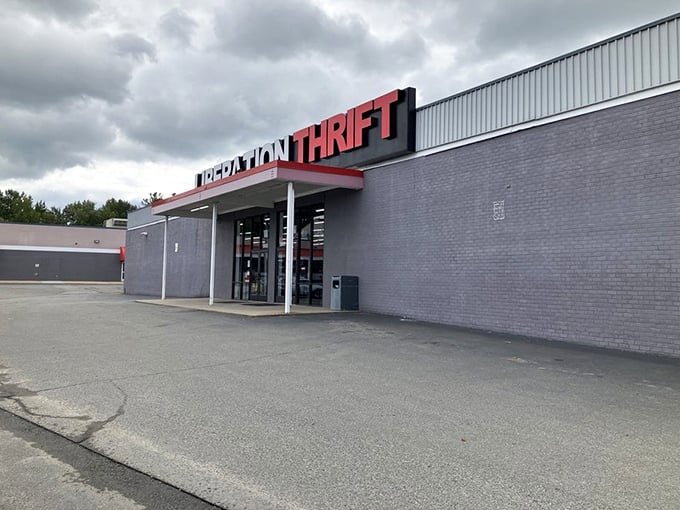 Liberation Thrift's bold red signage makes a statement against the gray building &ndash; impossible to miss!