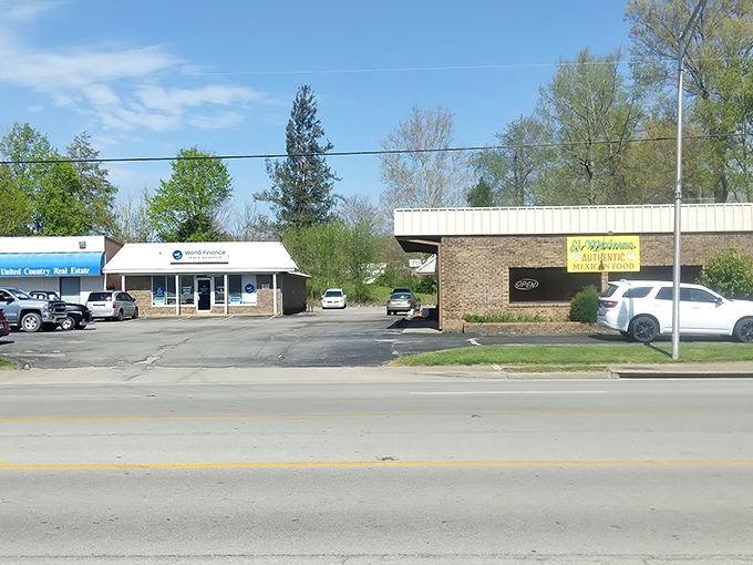 A quiet stretch of Liberty&rsquo;s main road, where tacos and tax help share the same parking lot.