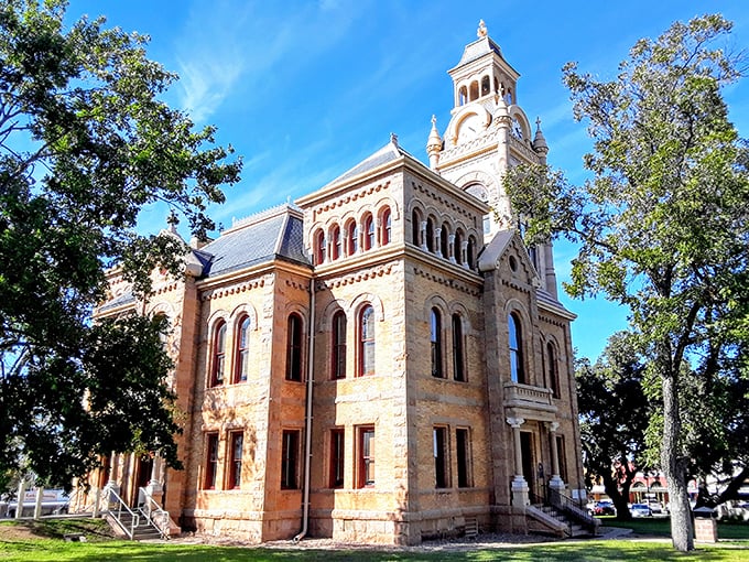 Llano's pink granite courthouse glows like a sunset jewel, anchoring this Hill Country town with timeless elegance.