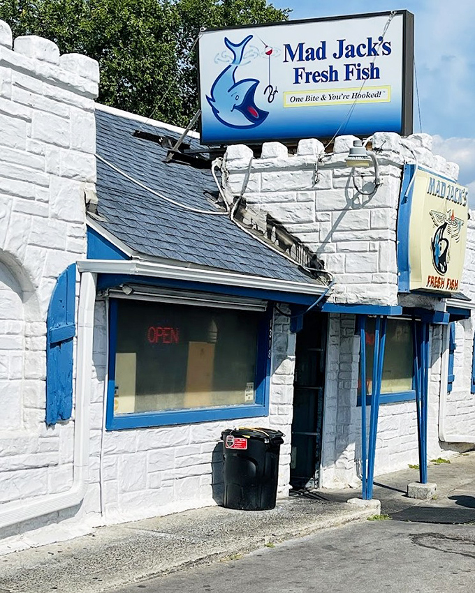 Mad Jack's bright blue trim pops against white walls, promising fresh catches that'll make your taste buds sing.