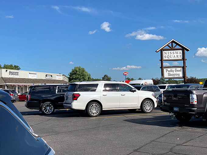 Summer resort magic sparkles in every shop window, hinting at lake adventures and turtle race excitement just ahead.