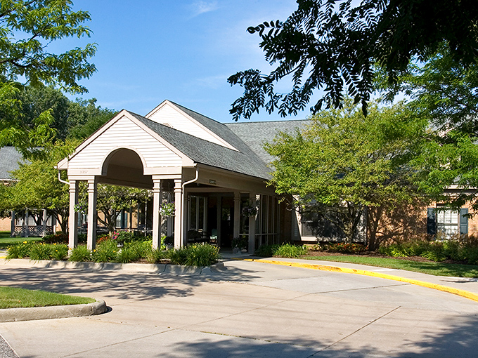 Oakmont Livonia's stately entrance says "distinguished living" while your bank account whispers "thank you" in relief.