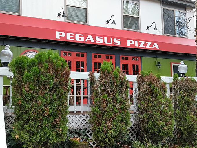 Green trim, red door, and a sign that promises legendary status &ndash; Eugene knows how to welcome pizza lovers. 