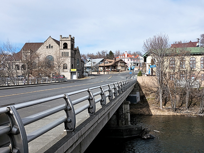A bridge spans the Umatilla River in Pendleton, connecting the town's historic buildings with its natural surroundings.