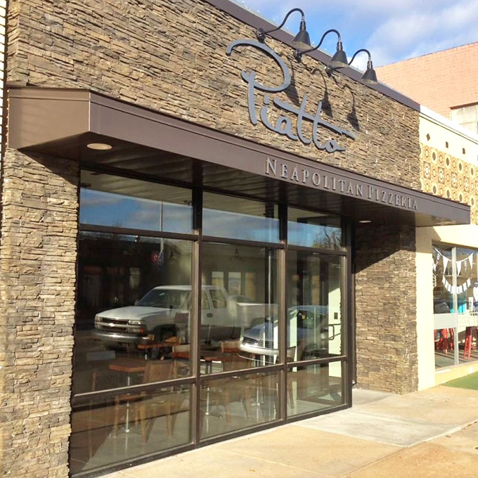 Piatto's sleek stone exterior whispers "authentic Neapolitan" before you even step inside. Sophistication meets comfort in this urban oasis.