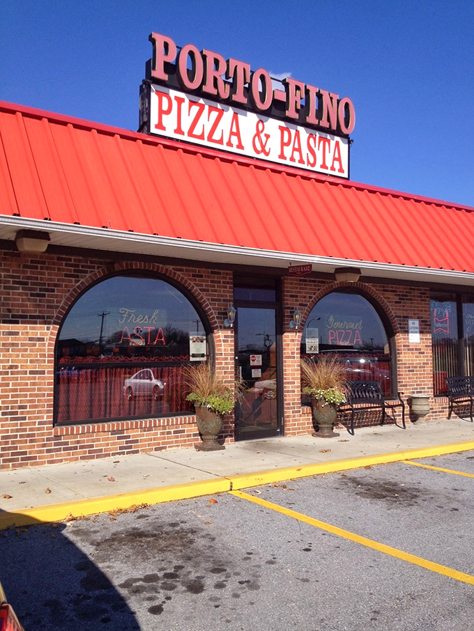 Red roof tiles whispering tales of old Italy while fresh pasta beckons through painted windows.