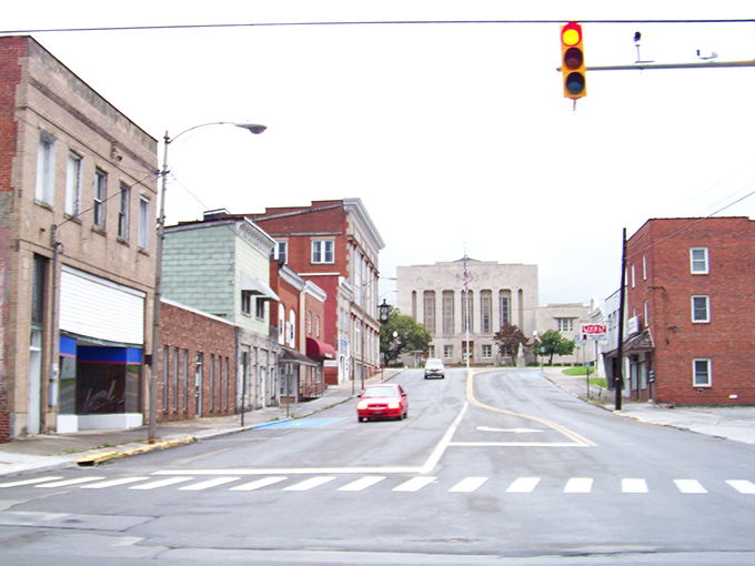 Princeton's municipal building stands like a courthouse on a hill, presiding over a street where crosswalks lead to possibility.