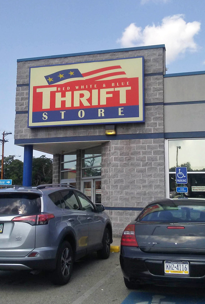 Red, white, blue, and bargains too! This patriotic thrift store proudly announces its community mission right on the sign.