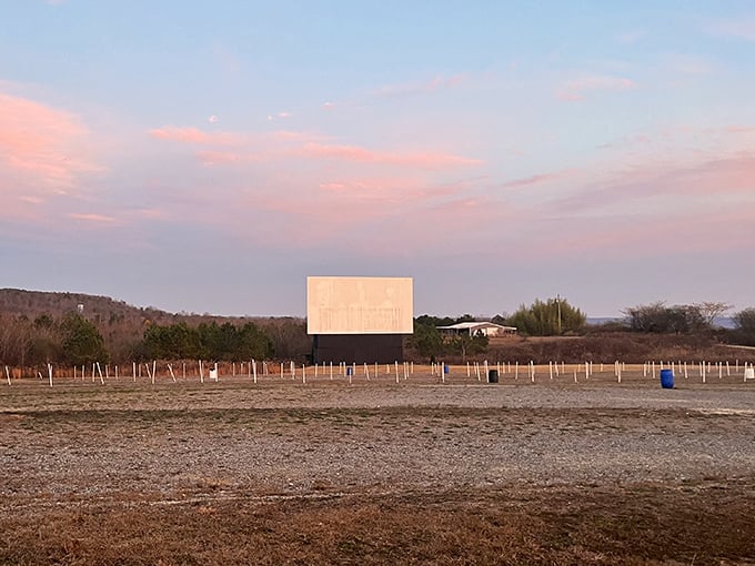 Pink skies frame the perfect evening escape. Ridgeview Drive-In offers sunset views before the feature presentation.