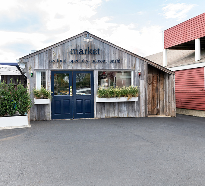 Weathered wood, navy blue doors, and the simple word "market"&mdash;sometimes the best seafood comes with the least fanfare.