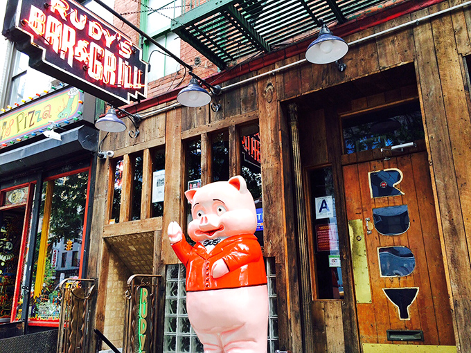 The cheerful pig mascot welcomes you to dive bar dining done absolutely right every time.