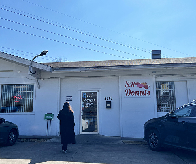 S H Donuts proves that sometimes greatness comes in humble packages. This white building might not win architecture awards, but it's winning breakfast battles daily.