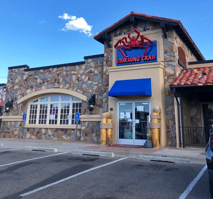 Storming Crab's stone fortress exterior with that bold red crab sign is basically seafood Camelot. Those nautical ropes aren't just for show!