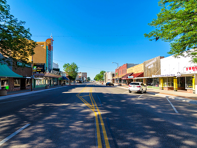 Wide streets and colorful storefronts create a perfect Main Street scene under Nebraska's brilliant blue sky.
