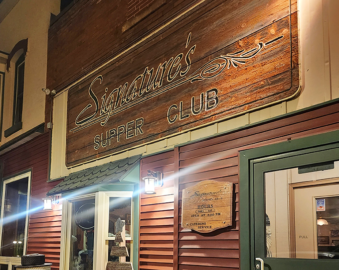 Signatures' wooden sign glows with promise, like a beacon guiding hungry travelers to steak salvation.