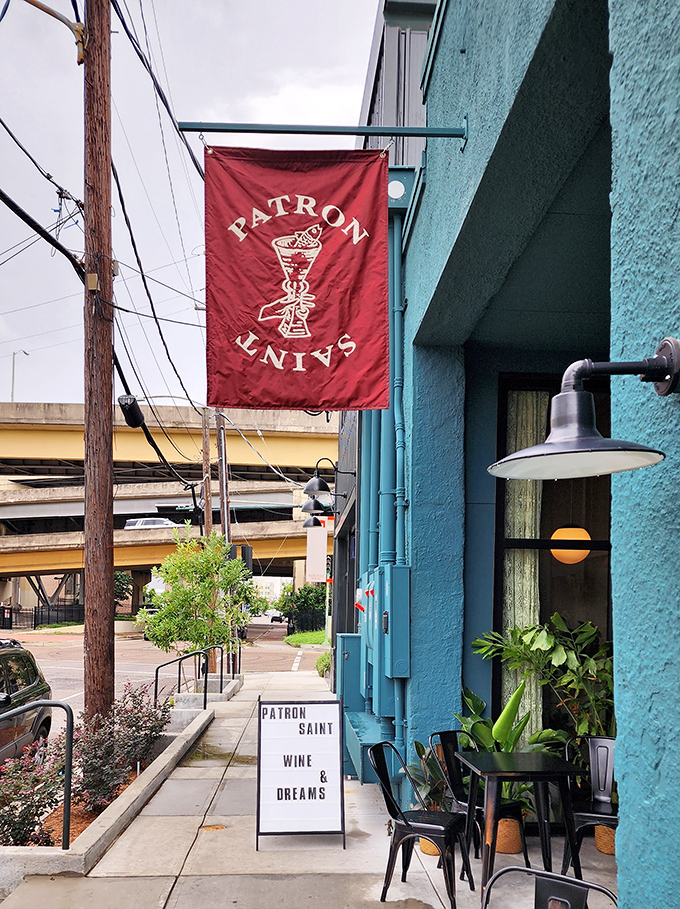 That turquoise building with the red "Patron Saint" banner isn't just eye-catching&mdash;it's a pizza prayer answered. Hallelujah for good taste!
