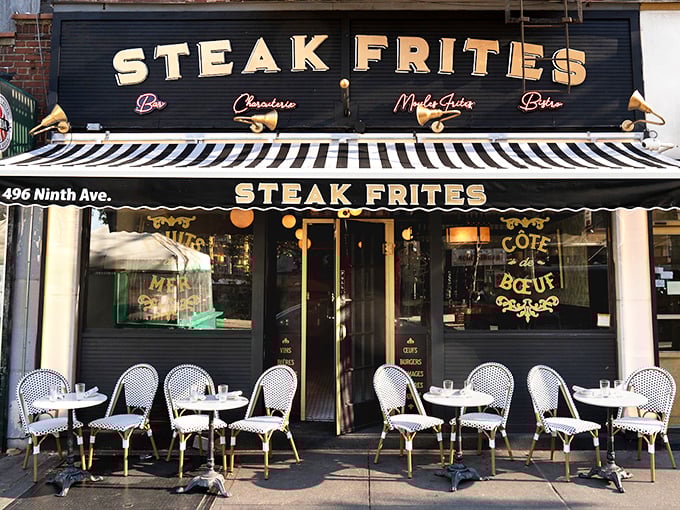 Those Parisian stripes and golden lights signal something special: French bistro charm meets perfectly cooked steak and fries.