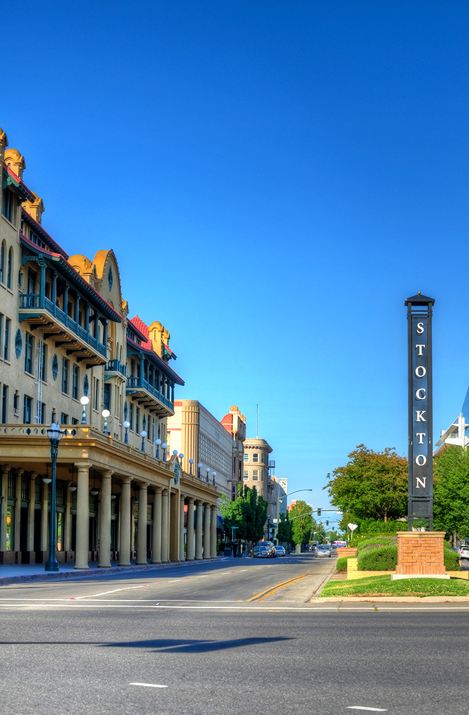 Classical columns line the street like a Greek temple dedicated to the art of living well.