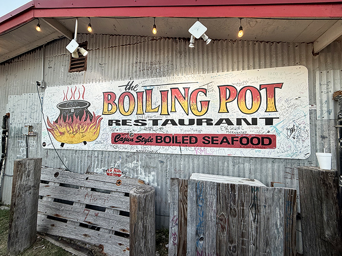 The Boiling Pot's rustic metal exterior and hand-painted sign promise messy, delicious seafood adventures ahead.