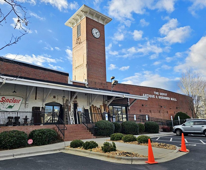 The Depot's iconic clock tower stands sentinel over decades of history, now housing treasures instead of textiles in this Concord landmark.