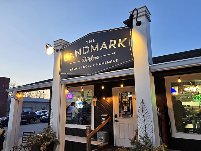The Landmark Bistro glows with evening invitation &ndash; those white pillars framing a modern take on Iowa's steakhouse tradition.