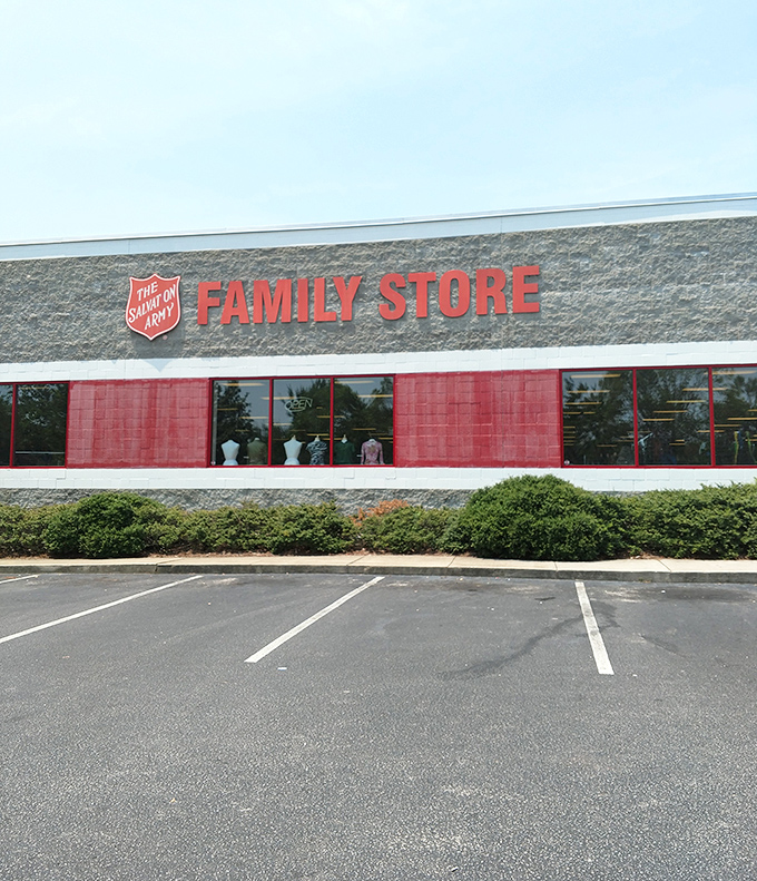 The Salvation Army's iconic red signage stands out against the stone facade. Inside: a bargain hunter's paradise awaits discovery.