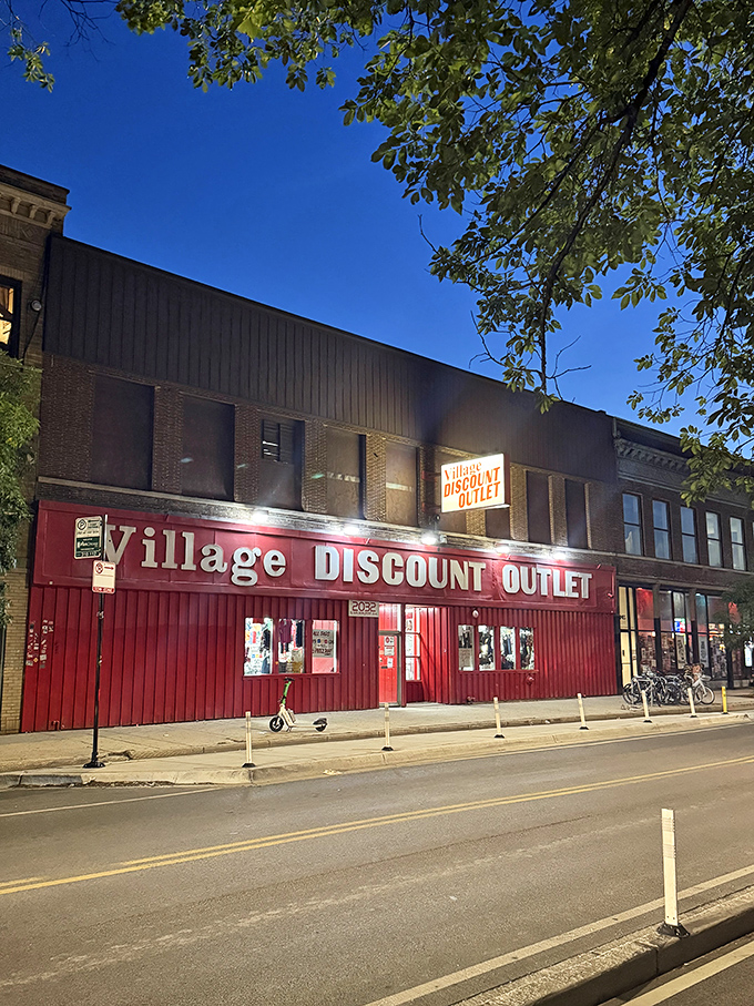 Village Discount's bold red storefront&mdash;like a matador's cape beckoning bargain bulls. The thrift equivalent of "We're open, come and get it!"