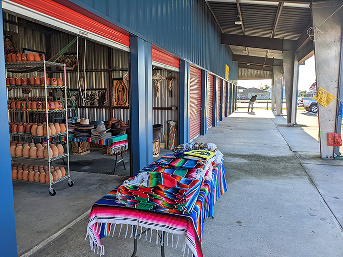 Colorful blankets and pottery create a fiesta atmosphere that makes shopping feel like celebrating.