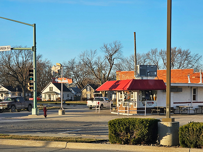 Winterset's town square represents small-town Iowa perfection, where John Wayne's boyhood dreams began beneath these towering courthouse clock towers.