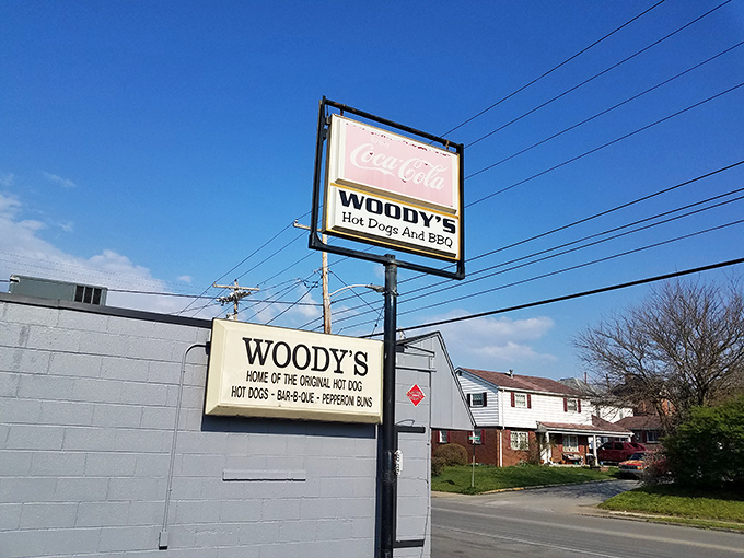 Woody's blue exterior with that classic Coca-Cola sign &ndash; like comfort food architecture that promises good things inside.