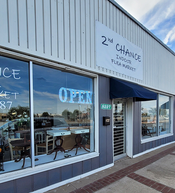 Blue neon beckons bargain lovers! 2nd Chance's windows reflect Arizona sky while promising indoor treasure hunting&mdash;like finding the perfect diner in a strange town.