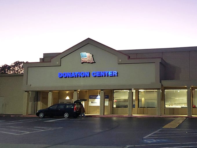 That donation center sign means fresh inventory flows like a river, constantly refreshing the treasure landscape.